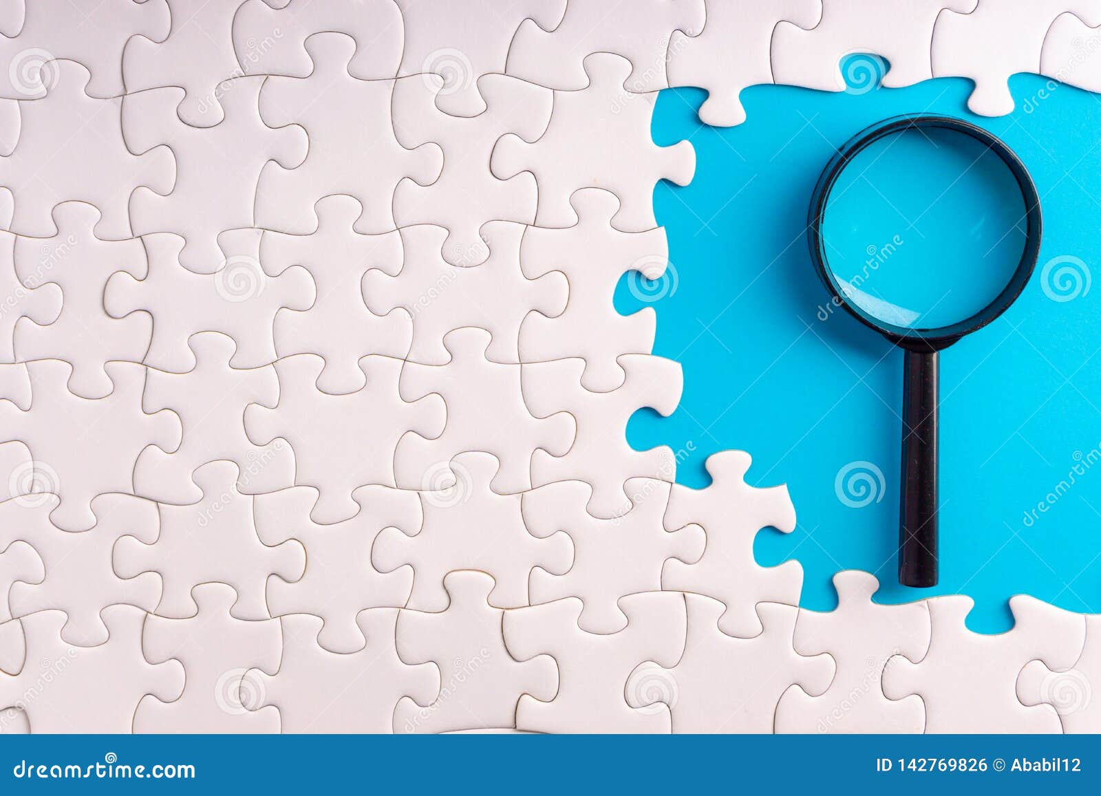 White Jigsaw Puzzle, Magnifier and Missing Pieces with Selective Focus ... White Jigsaw Puzzle, Magnifier and Missing Pieces with Selective Focus ...