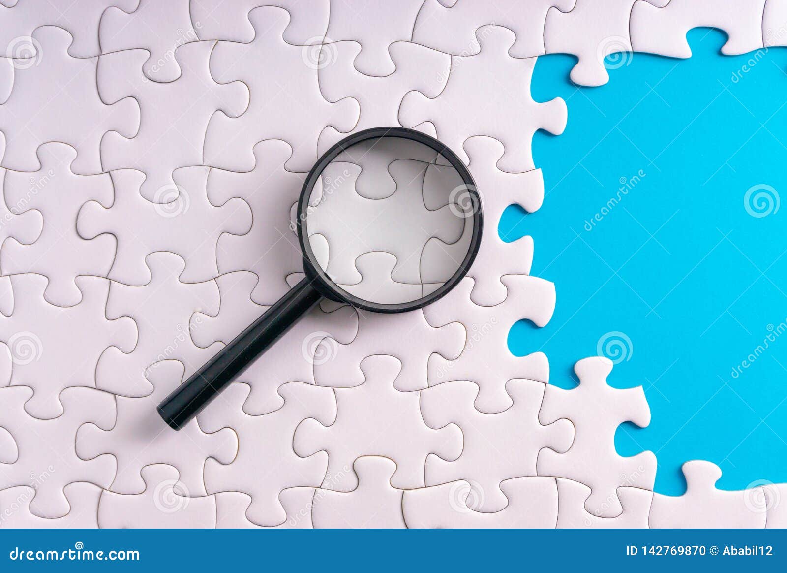 White Jigsaw Puzzle, Magnifier and Missing Pieces with Selective Focus ... White Jigsaw Puzzle, Magnifier and Missing Pieces with Selective Focus ...
