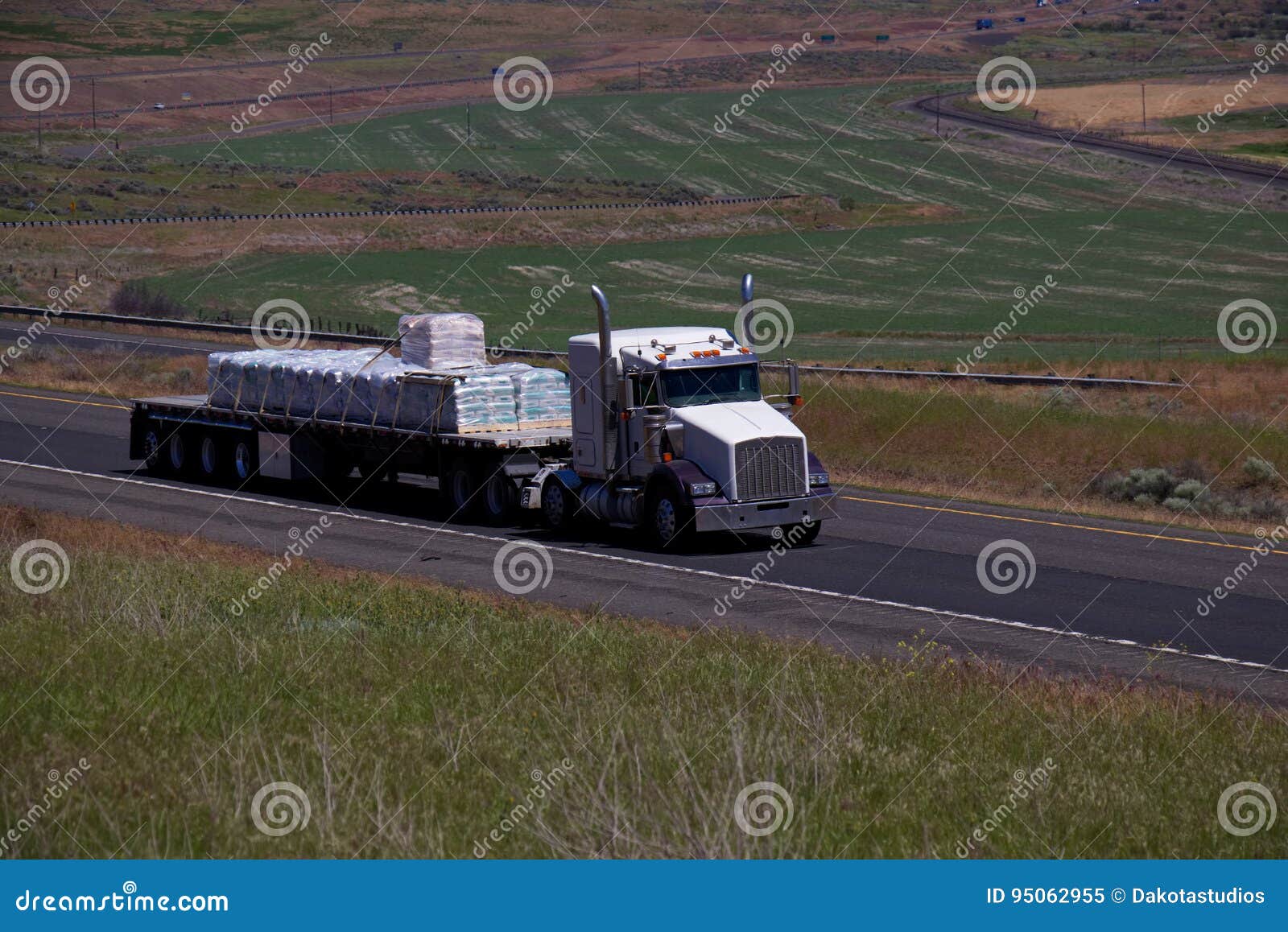 White Kenworth / Loaded Flatbed Editorial Image - Image of tractor ...
