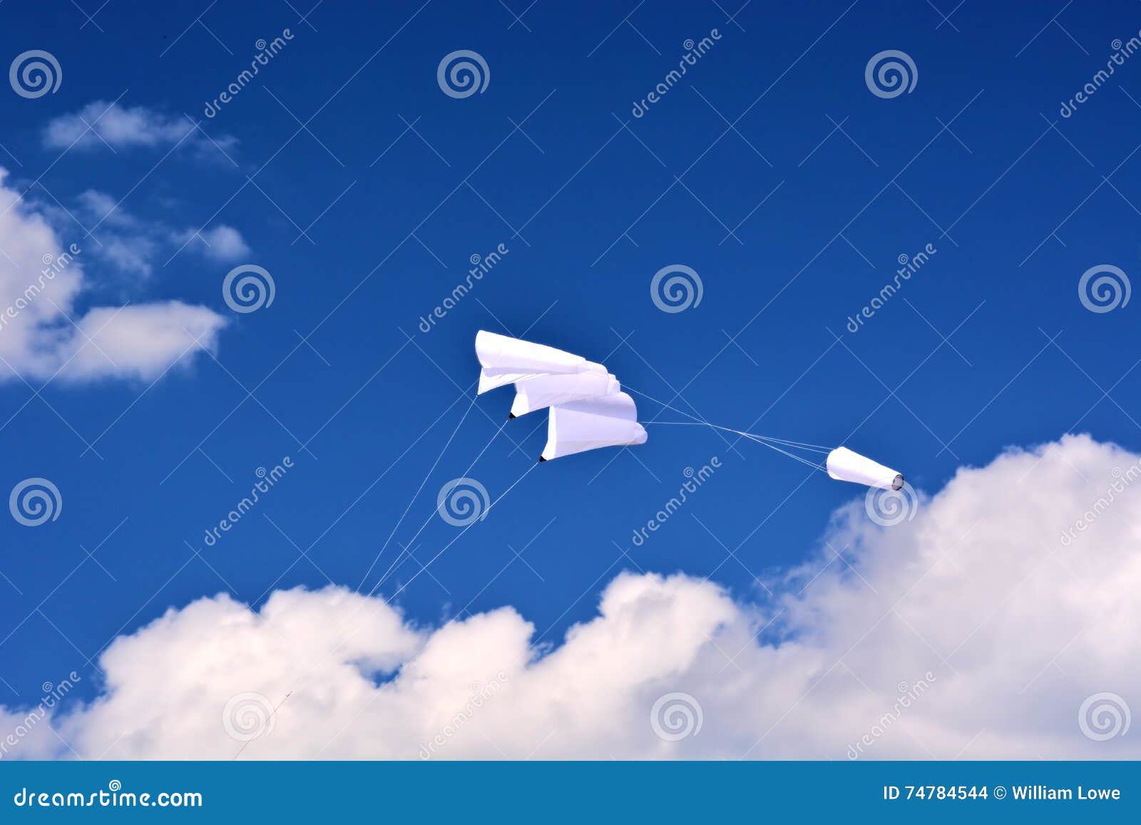 White Kite Above the Clouds Stock Photo - Image of white, clouds: 74784544