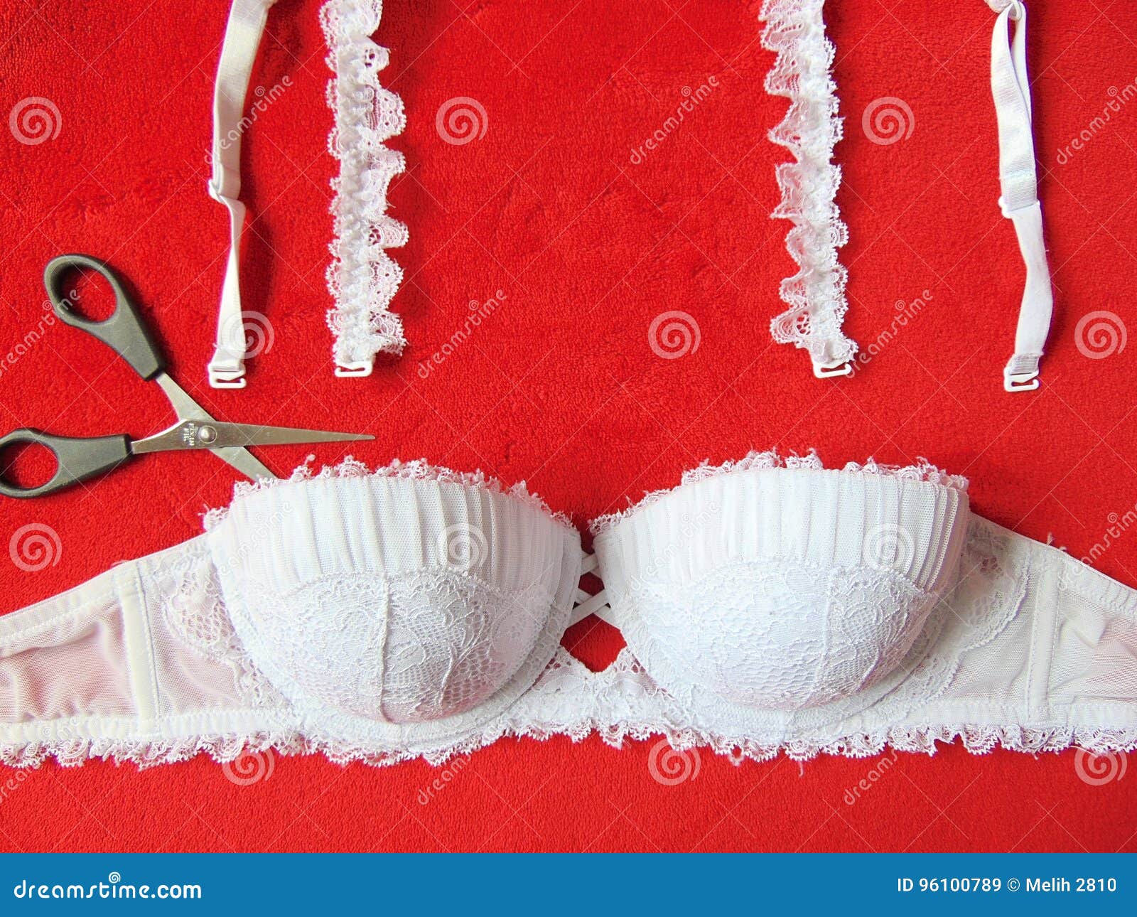 White Lace Strapless Bra with Scissors Cutting the Straps Stock Image ...
