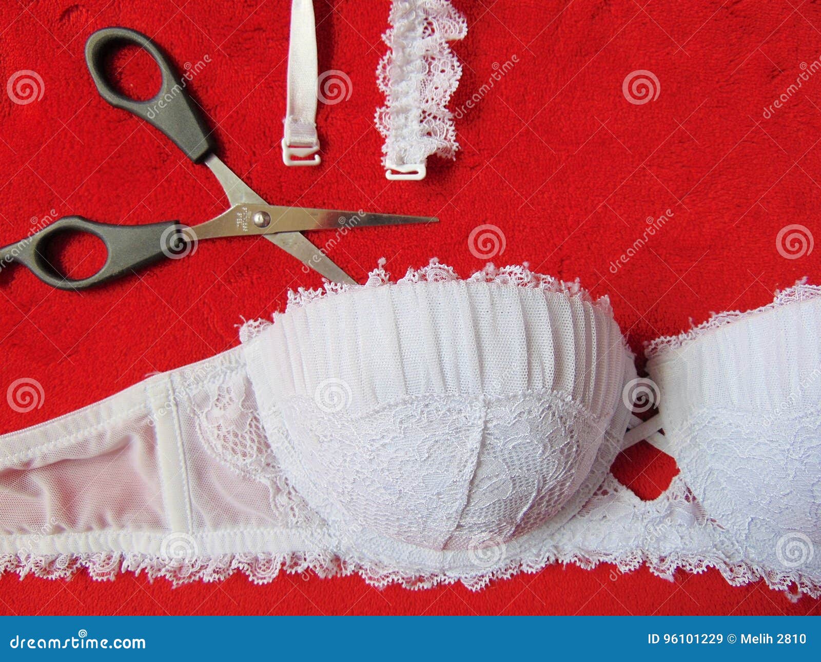 White Lace Strapless Bra with Scissors Cutting the Straps Stock Image ...