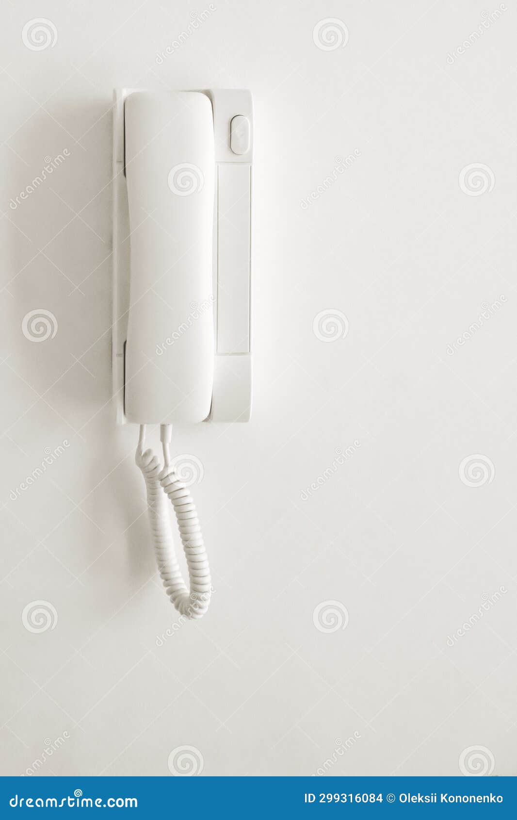 A White Landline Telephone is Mounted on a White Wall Stock Photo ...