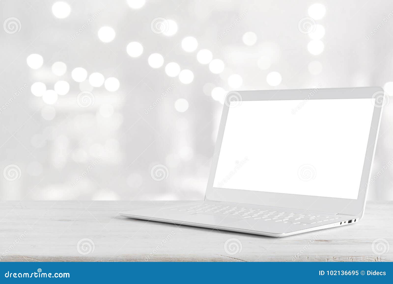 White Laptop Computer on Wooden Table Over Abstract Lights Background ...