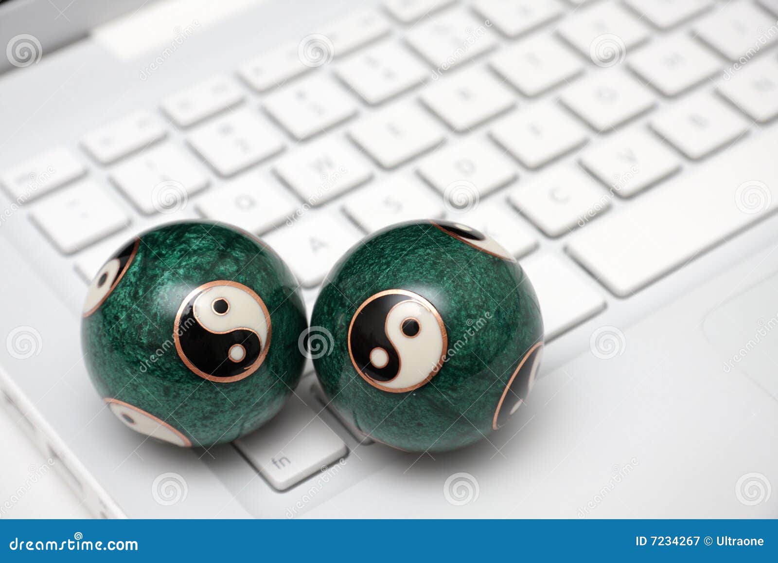 White Laptop With Yin Yang Balls On A Keyboard. Stock Image ...