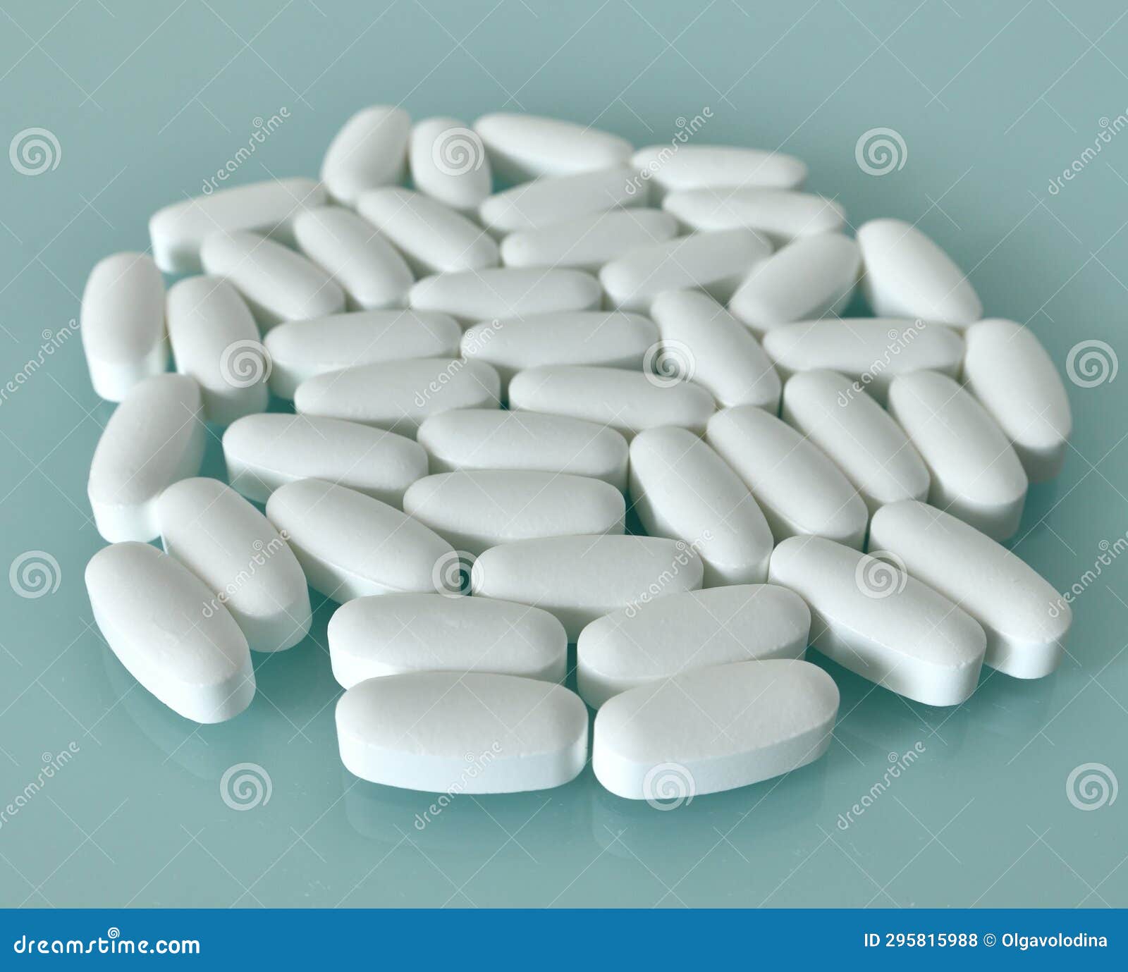 White Large Pills on a Blue Background Stock Photo - Image of tablet ...