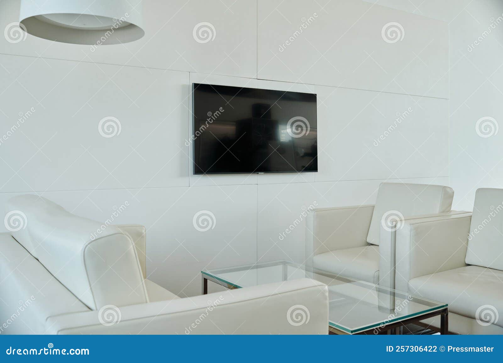 White Leather Couch and Two Armchairs Surrounding Rectangular Glass ...