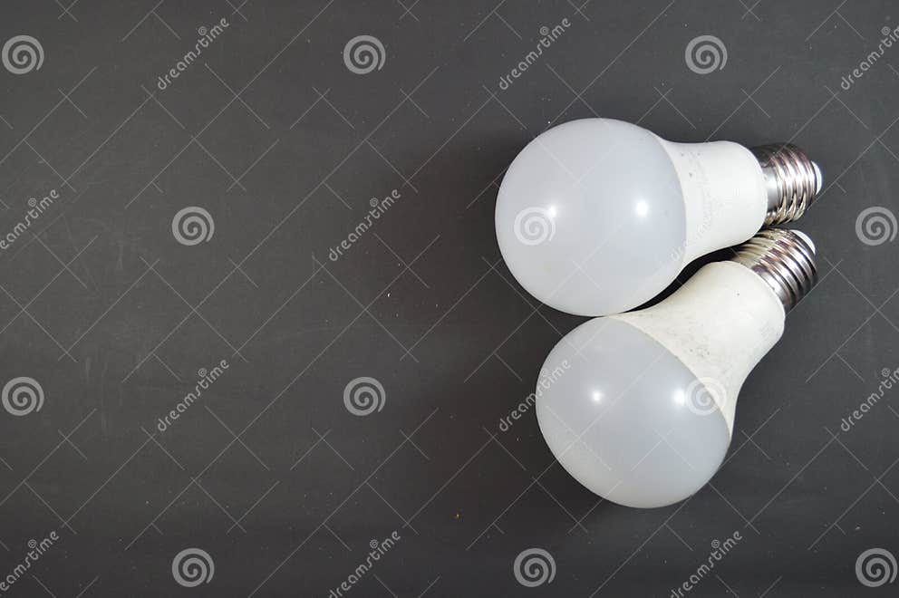White Light Bulb on Black Background. Stock Image - Image of blue, hand ...