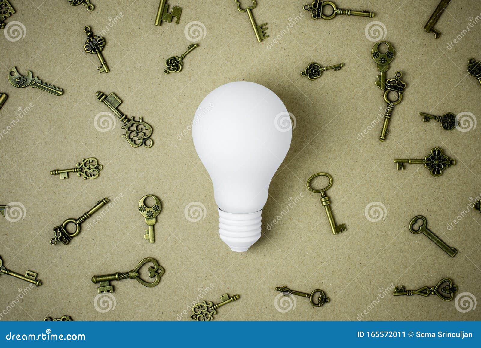 White Light Bulb and Many Keys on Brown Paper. Stock Image - Image of ...