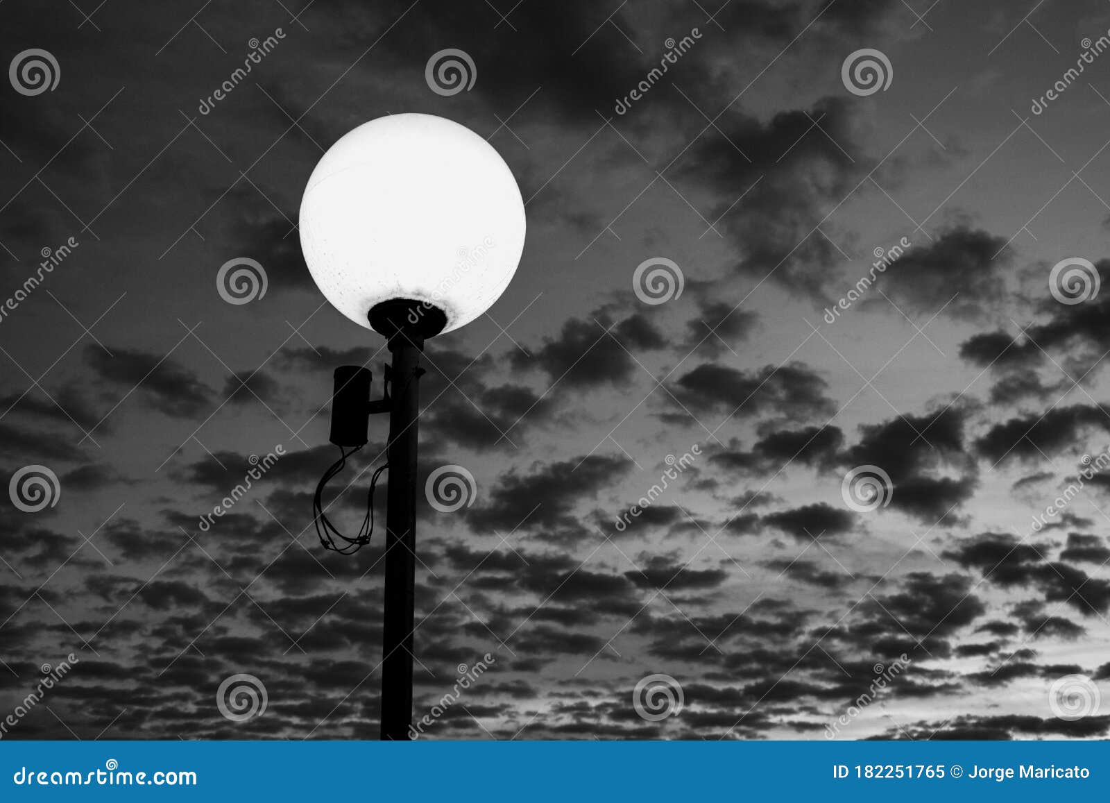 White Light Post Be Showing with a Beautiful Cloudy Sky at a Sunset ...