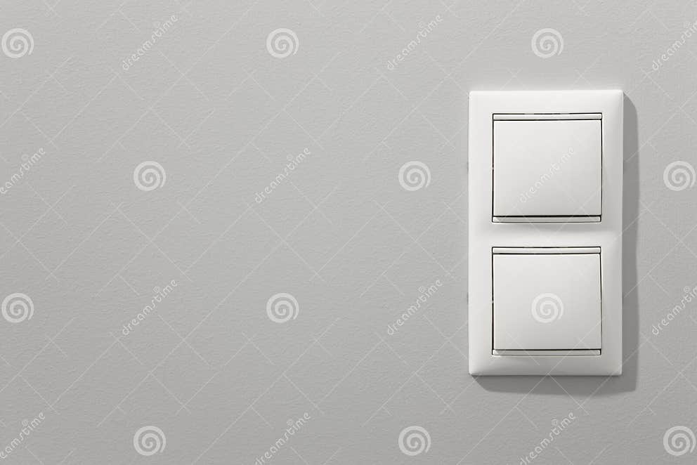 White Light Switches Over a Grey Wall Stock Photo - Image of electric ...