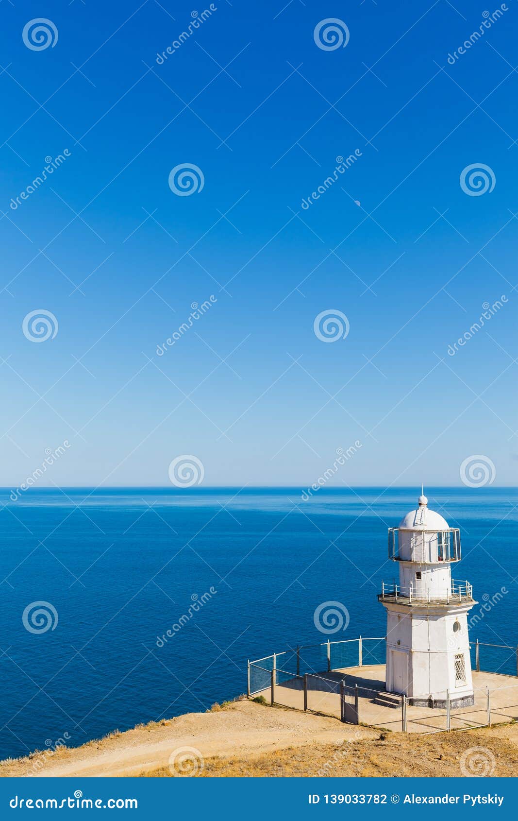 White Lighthouse on a Background of Blue Sea Stock Photo - Image of ...
