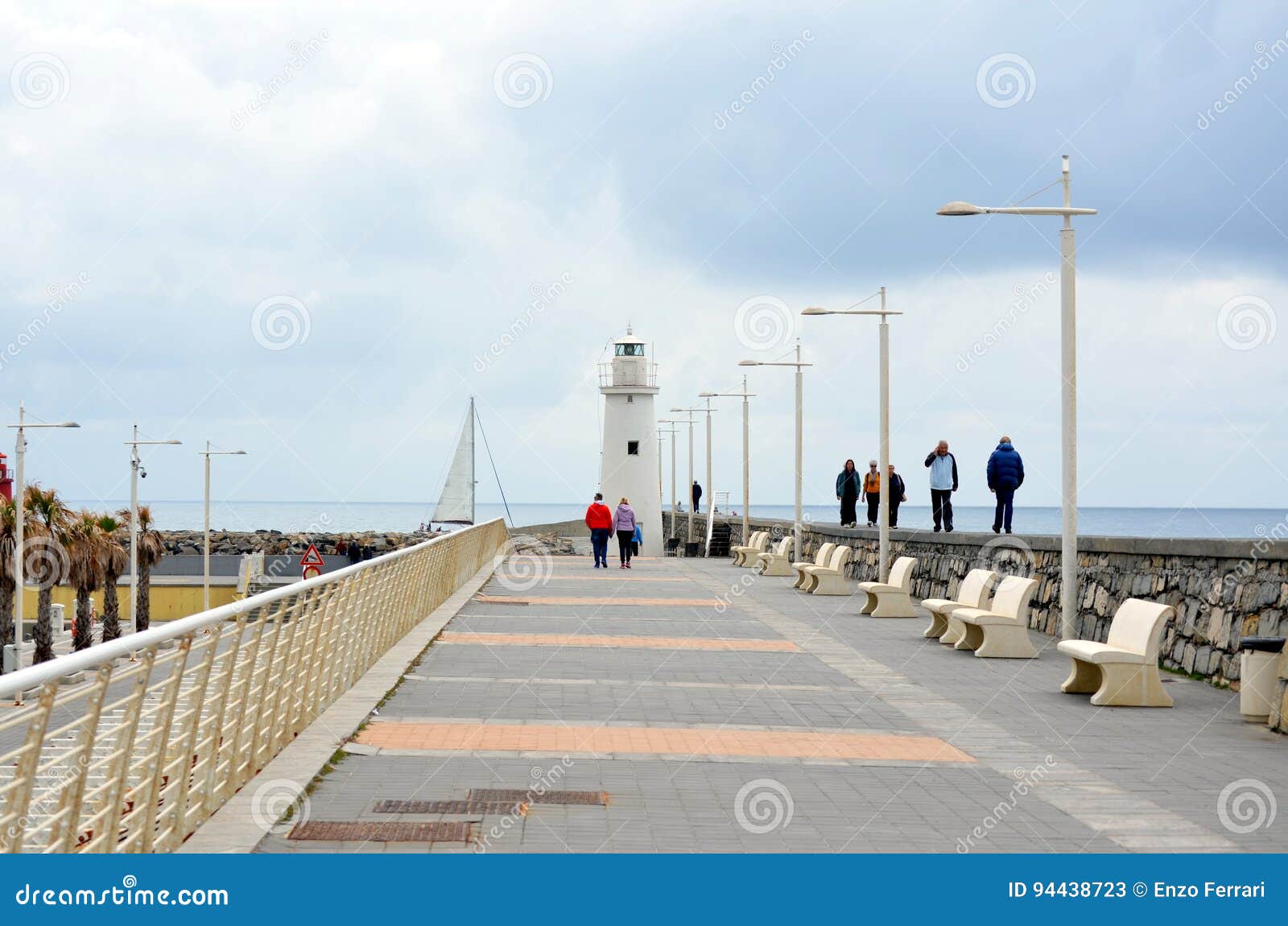 White Lighthouse at the Bottom of the Road Stock Image - Image of ...