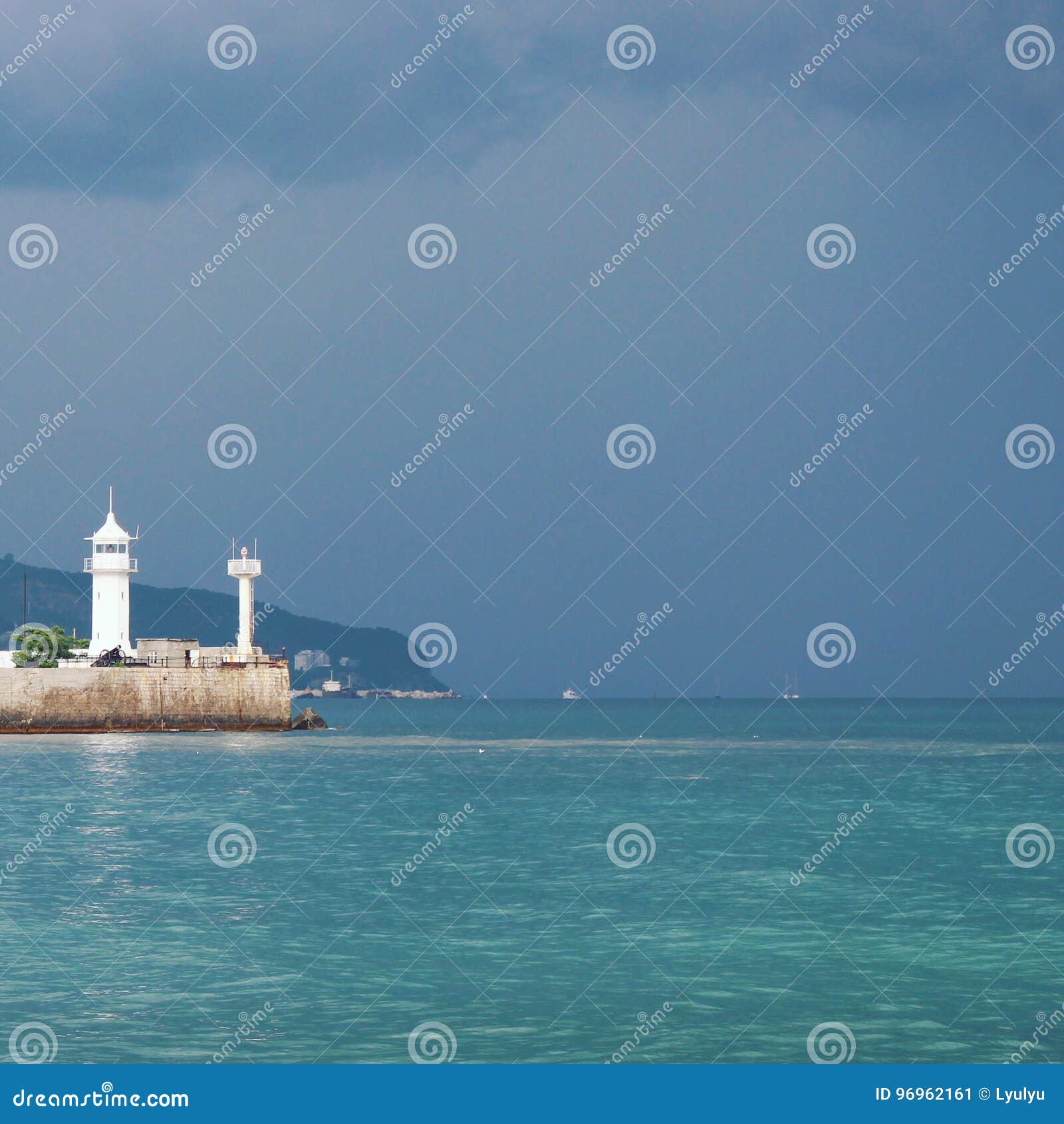White Lighthouse on a Cloudy Day Stock Image - Image of cloudy, pier ...