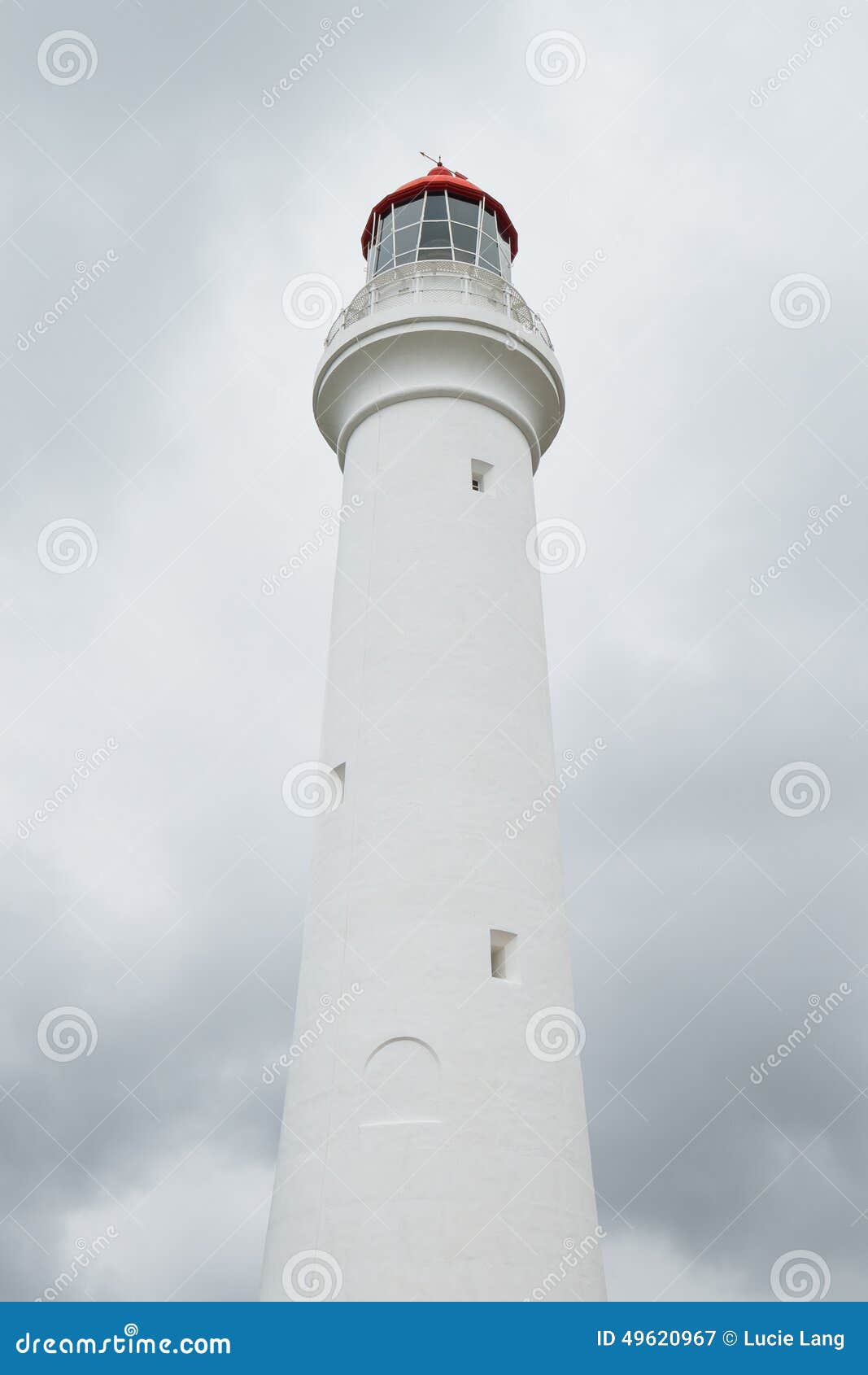 White Lighthouse in Front of Storm Clouds Stock Image - Image of ...