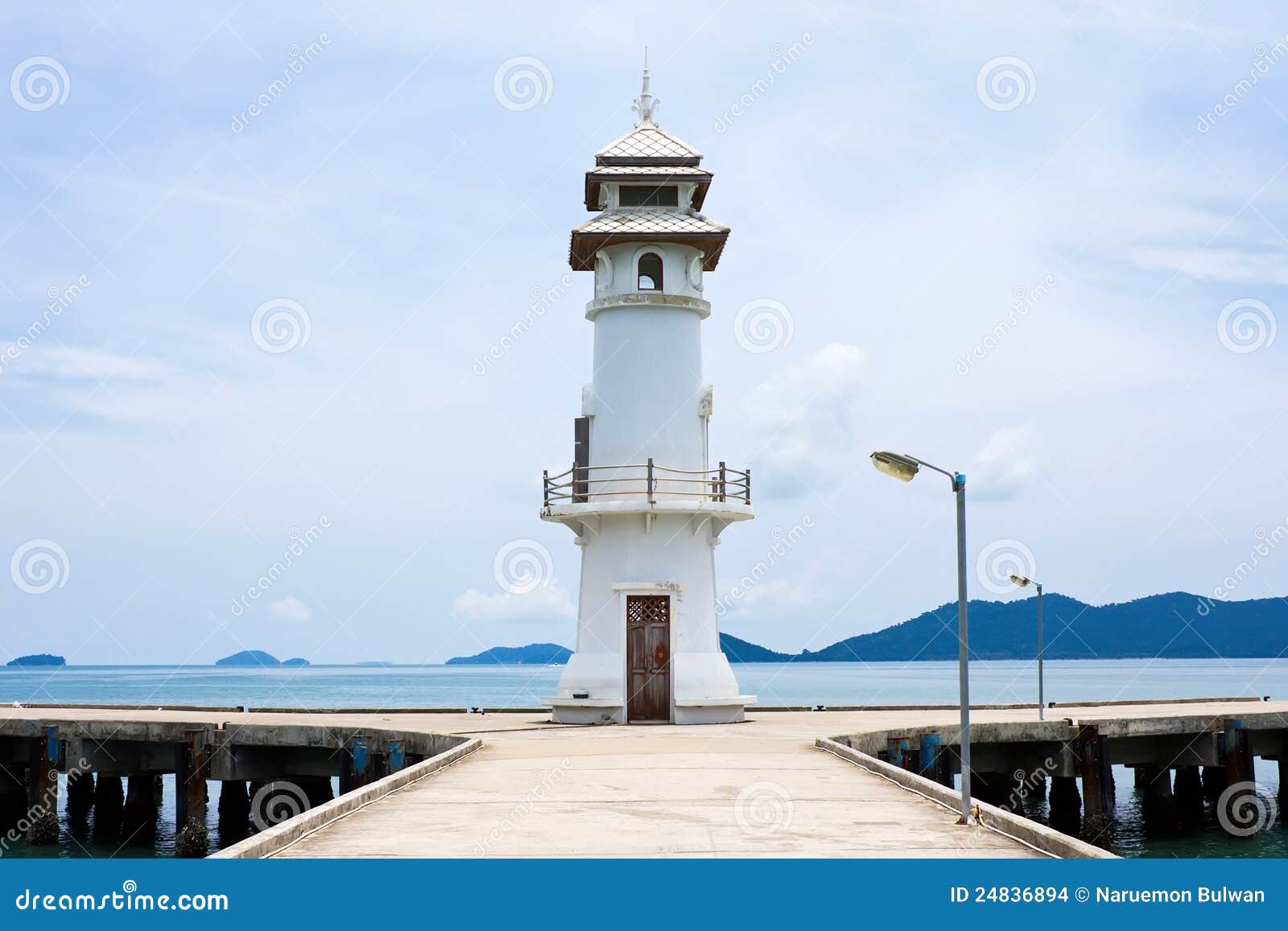 White lighthouse on jetty stock photo. Image of tree - 24836894
