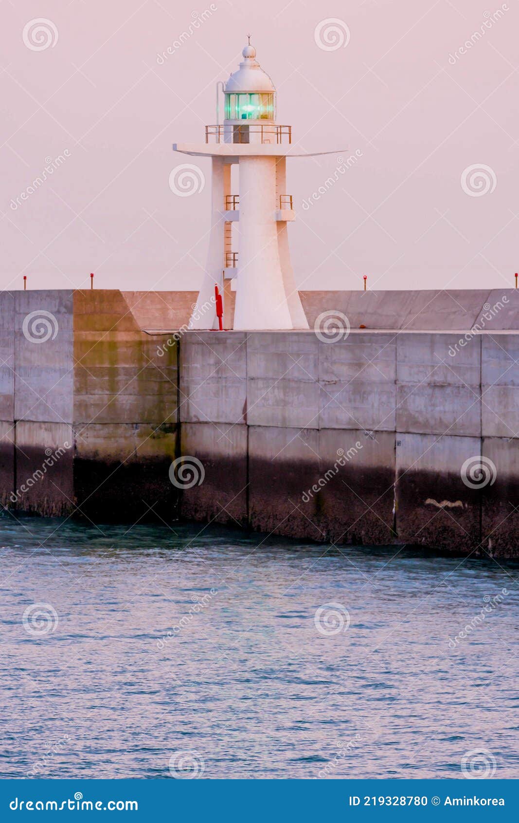 White Lighthouse Lighted Green Beacon Stock Photo - Image of blue ...