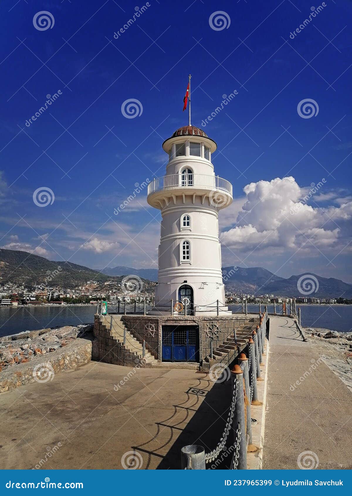 A White Lighthouse Points the Way for Ships Stock Image - Image of ...