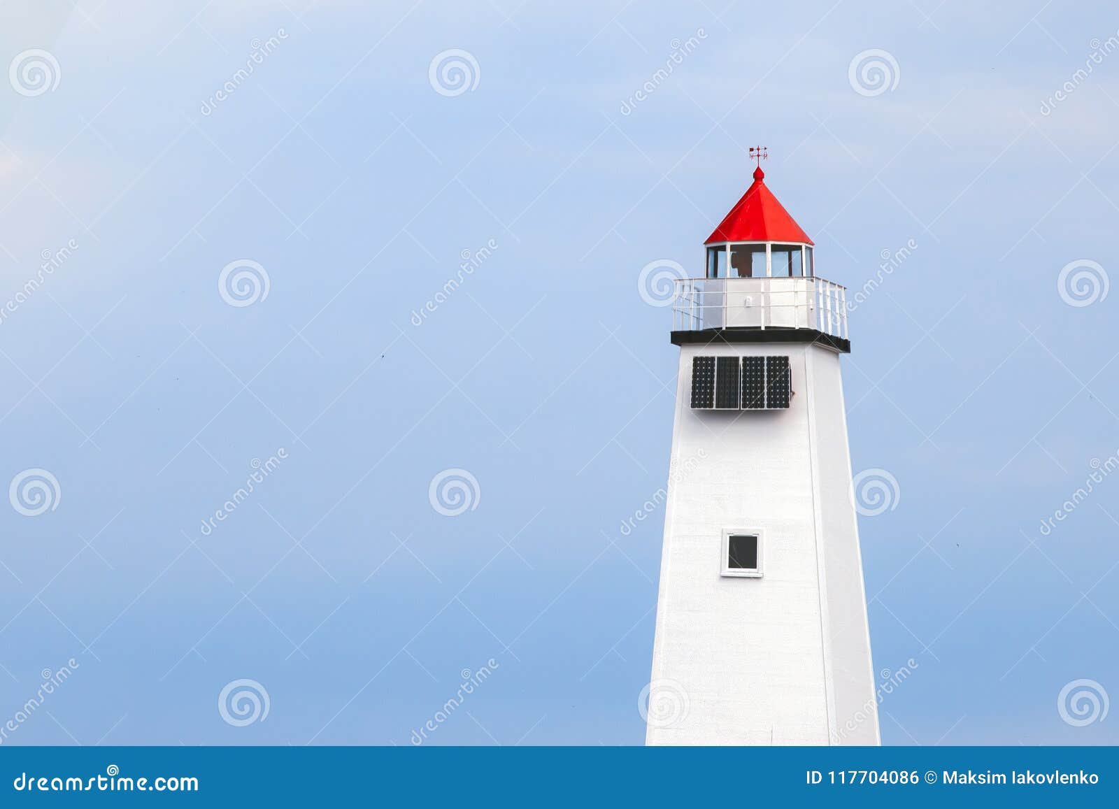 White Lighthouse with a Red Roof Against the Sky. Stock Photo - Image ...