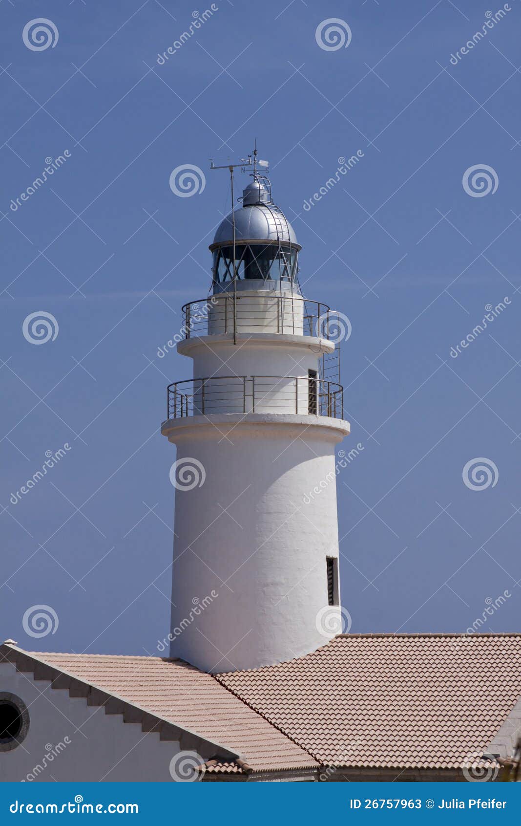 White Lighthouse on Rocks in the Sea Ocean Water Sky Blue Stock Image ...