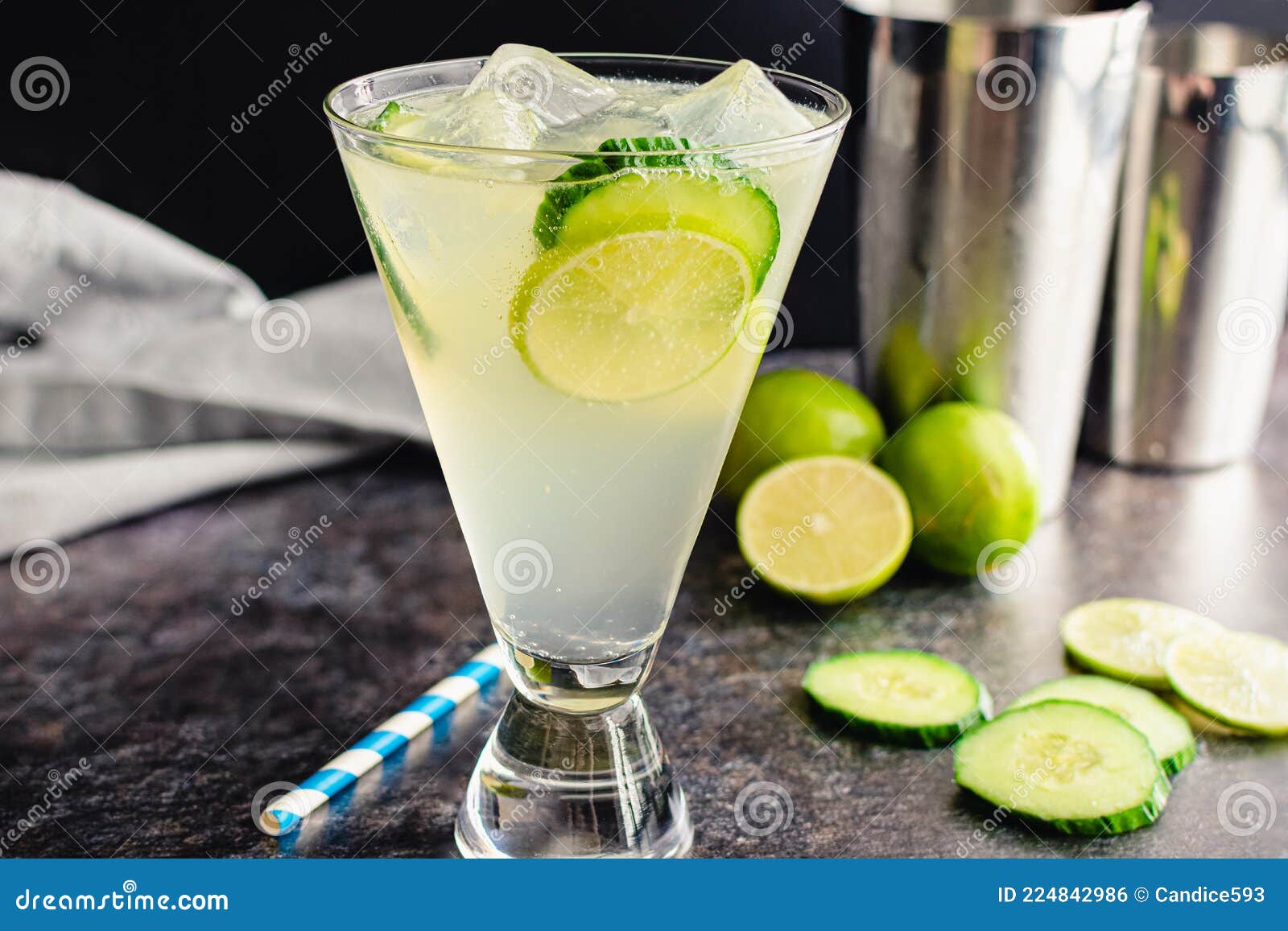 White Linen Cocktail with Cucumber and Lime Garnish Stock Photo - Image ...