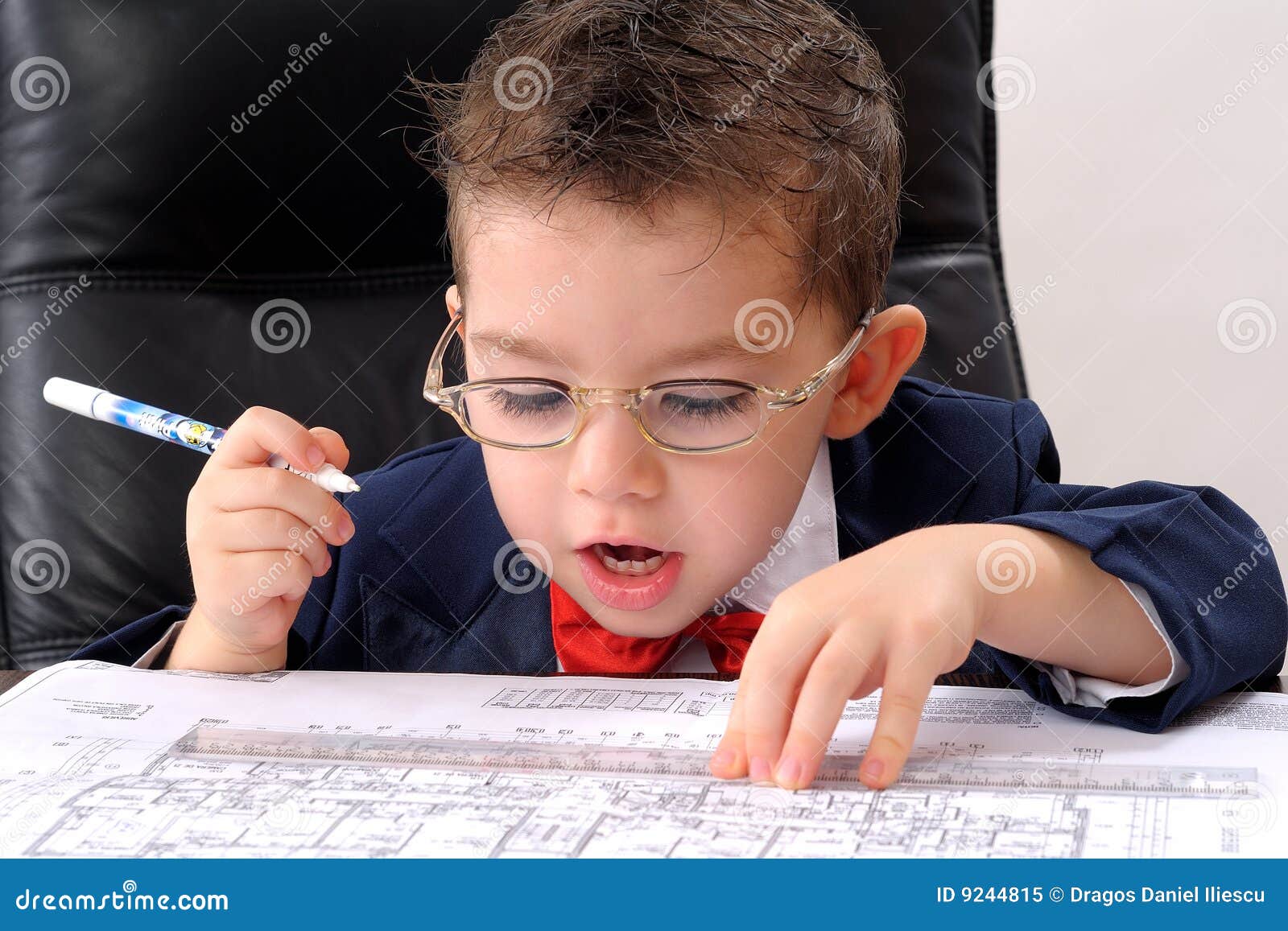 White Little Boy Studying Papers in Office Stock Image - Image of ...