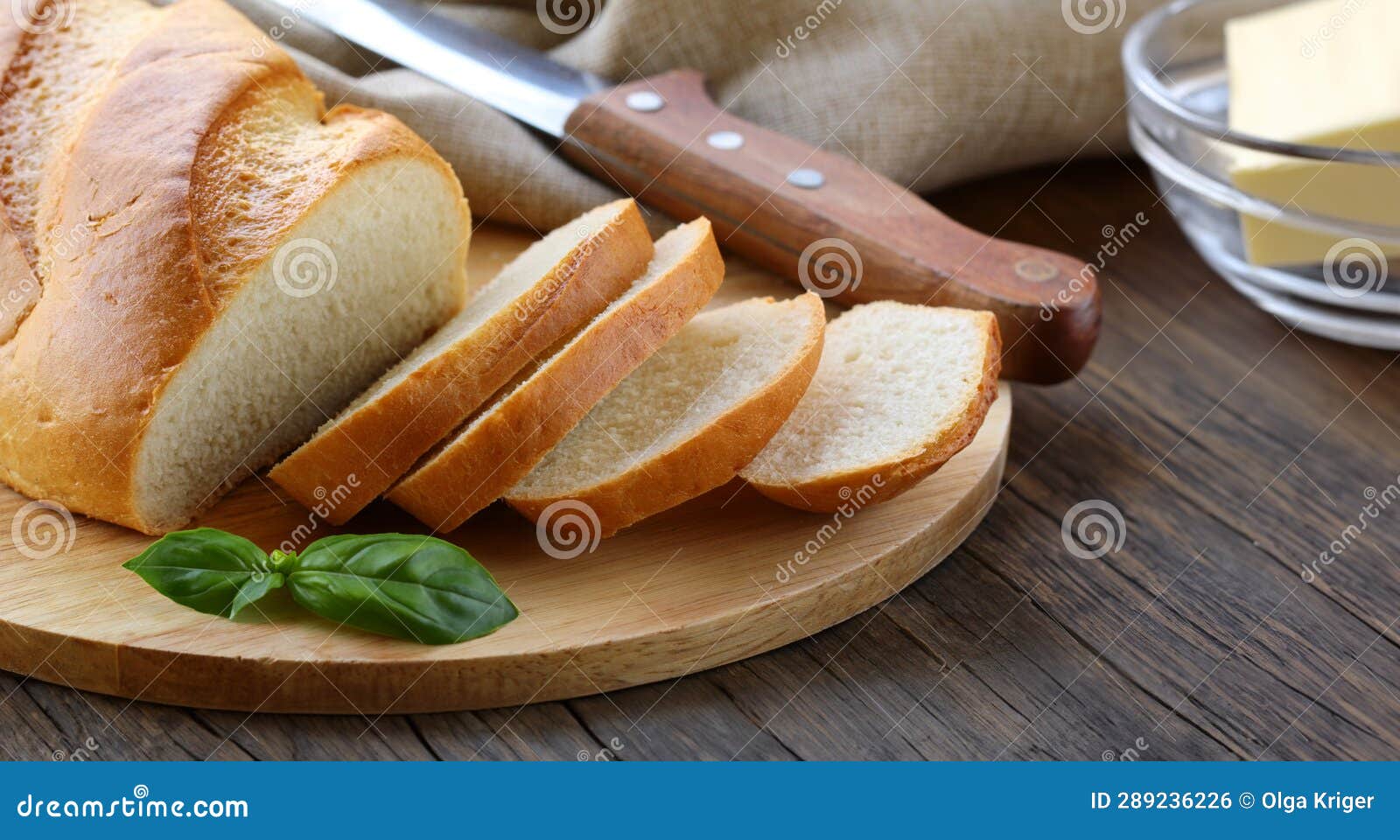 White loaf of bread sliced stock photo. Image of board - 289236226