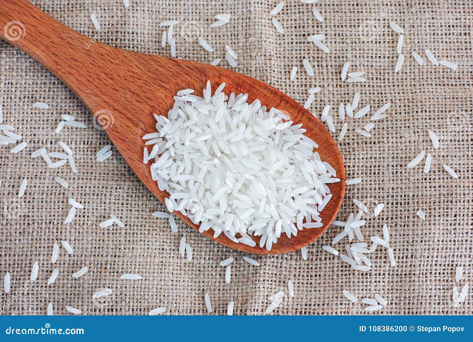 White Long Rice in a Wooden Spoon Stock Photo - Image of healthy, spoon ...