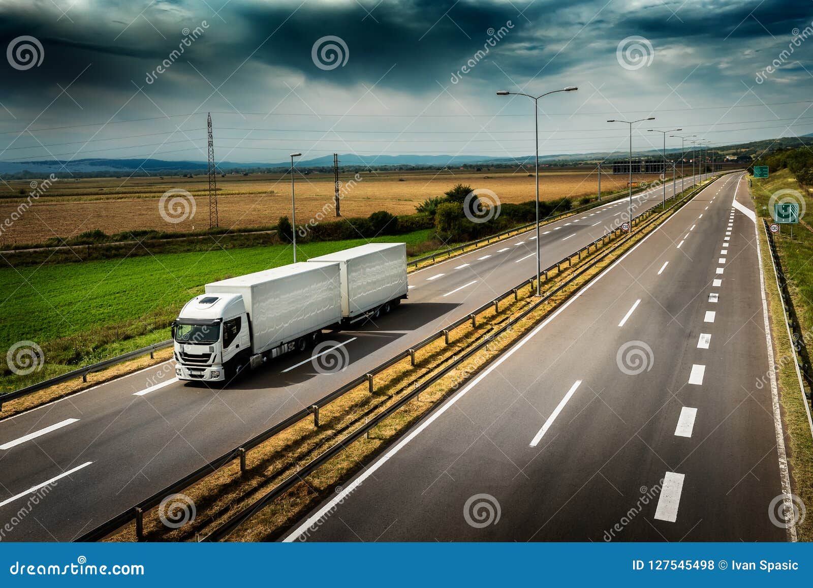 White Lorry on a Highway at a Cloudy Day Stock Photo - Image of freight ...
