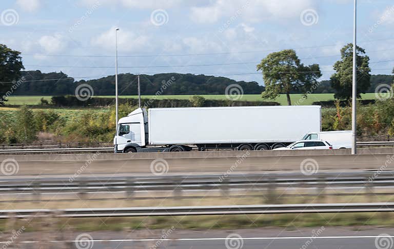 White lorry on the road stock photo. Image of landscape - 79052726