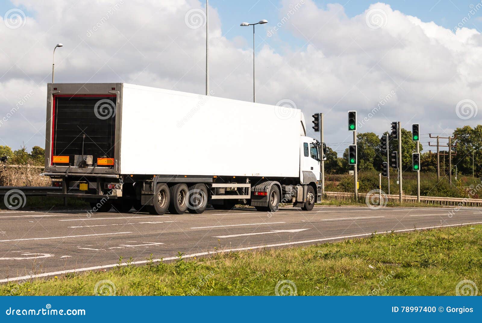 White lorry on the road stock photo. Image of lorry, clouds - 78997400