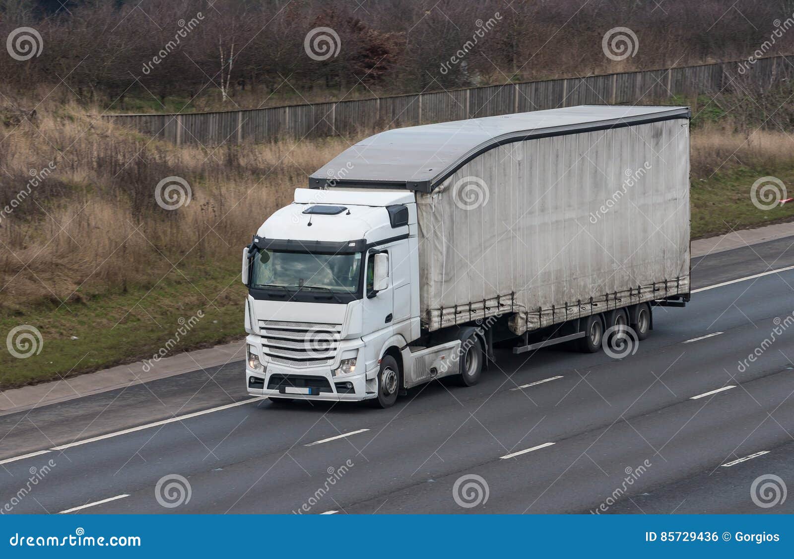 White Lorry with Trailer in Motion on the Motorway Stock Photo - Image ...