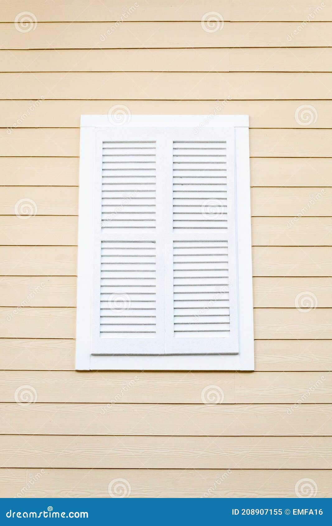 White Louvered Window Shutter on a Cream Wooden Building Stock Image ...