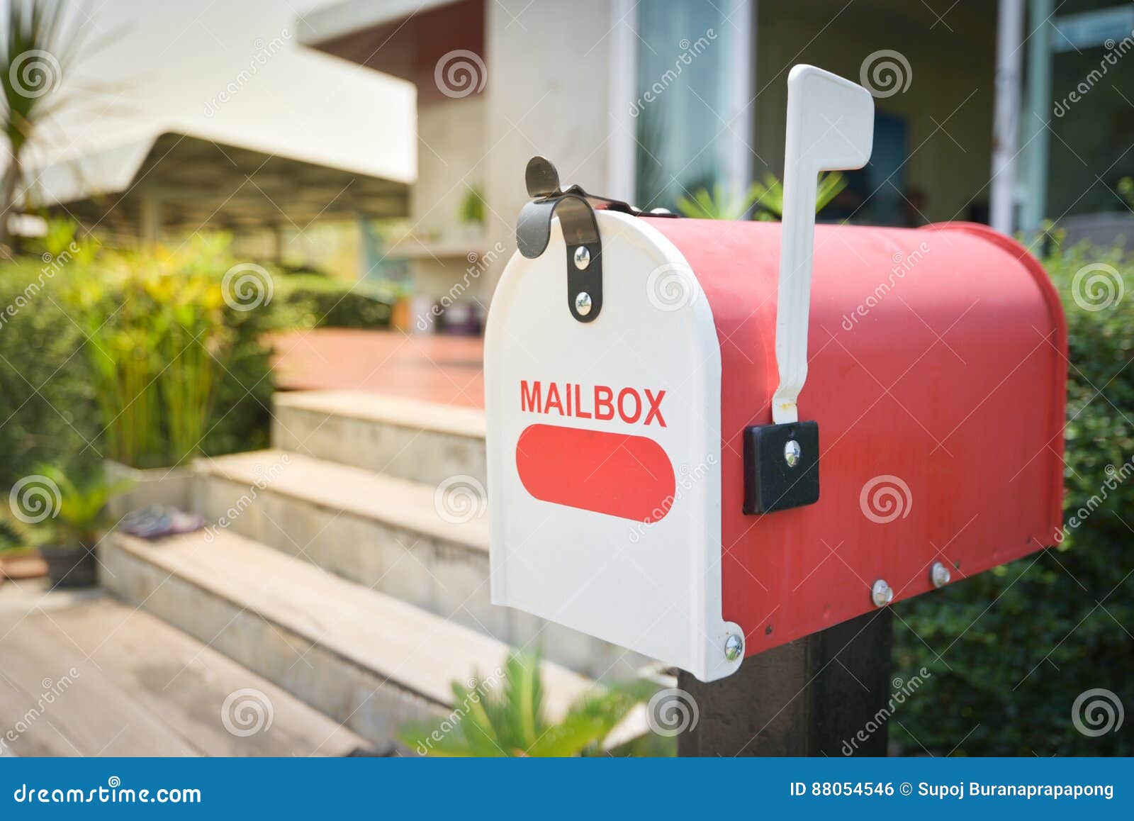 White Mail Box in Front of a House Stock Photo - Image of garden ...