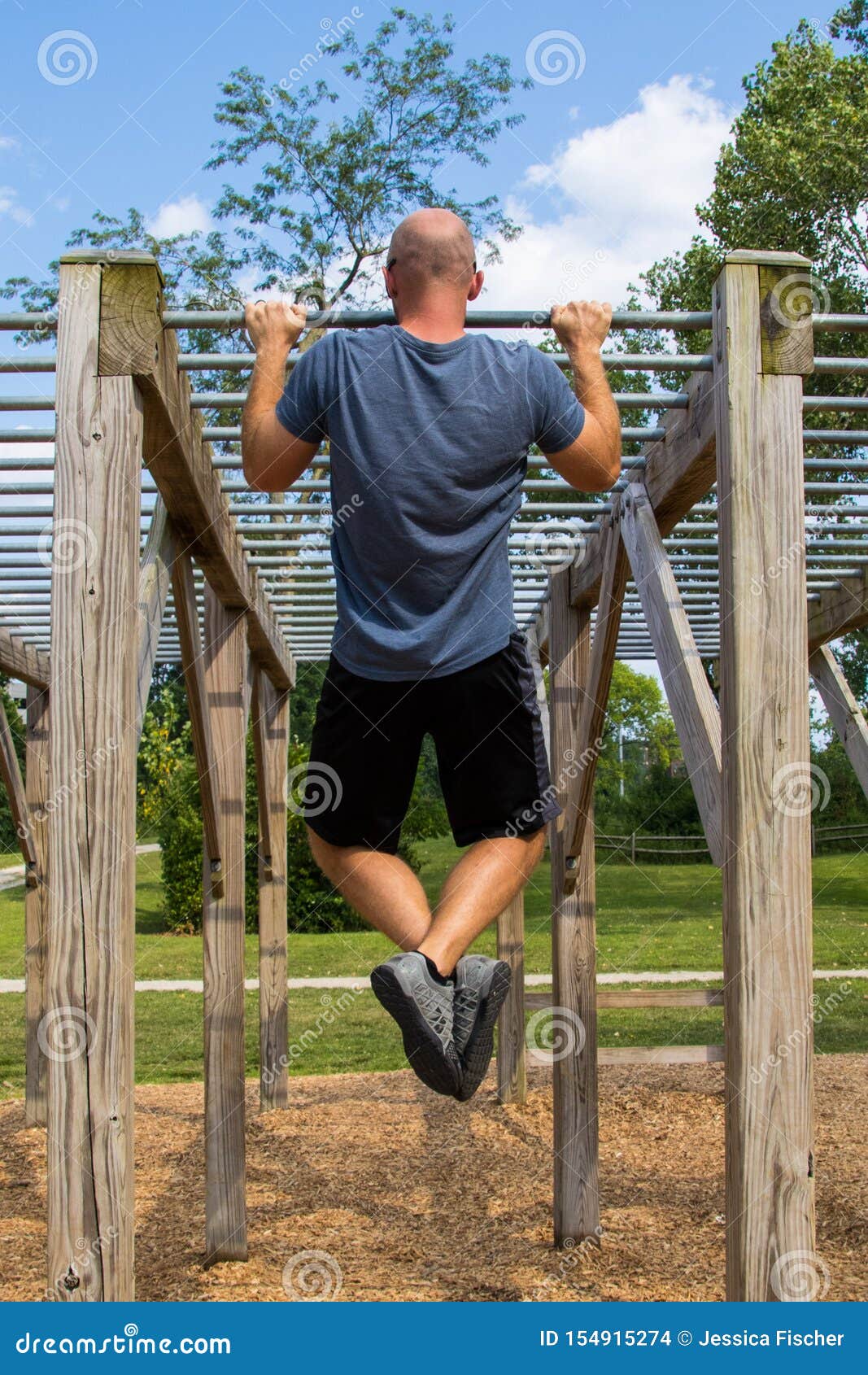 Man Doing Pull Ups Outdoors Stock Photo - Image of exercising, active ...