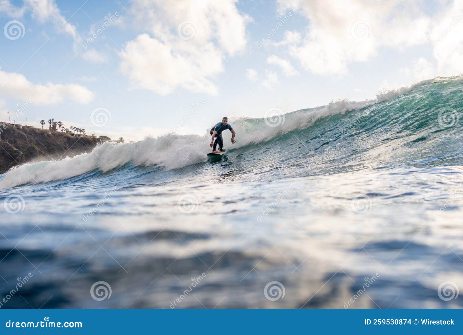 White Man Surfing on Beach Waves Against the Bright Sky Stock Photo ...