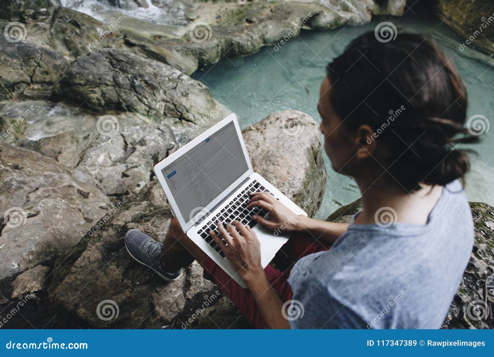 White Man Using Computer Laptop at Waterfall Stock Image - Image of ...