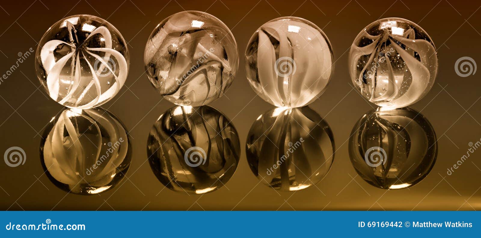 White marbles on gold stock photo. Image of ball, four - 69169442