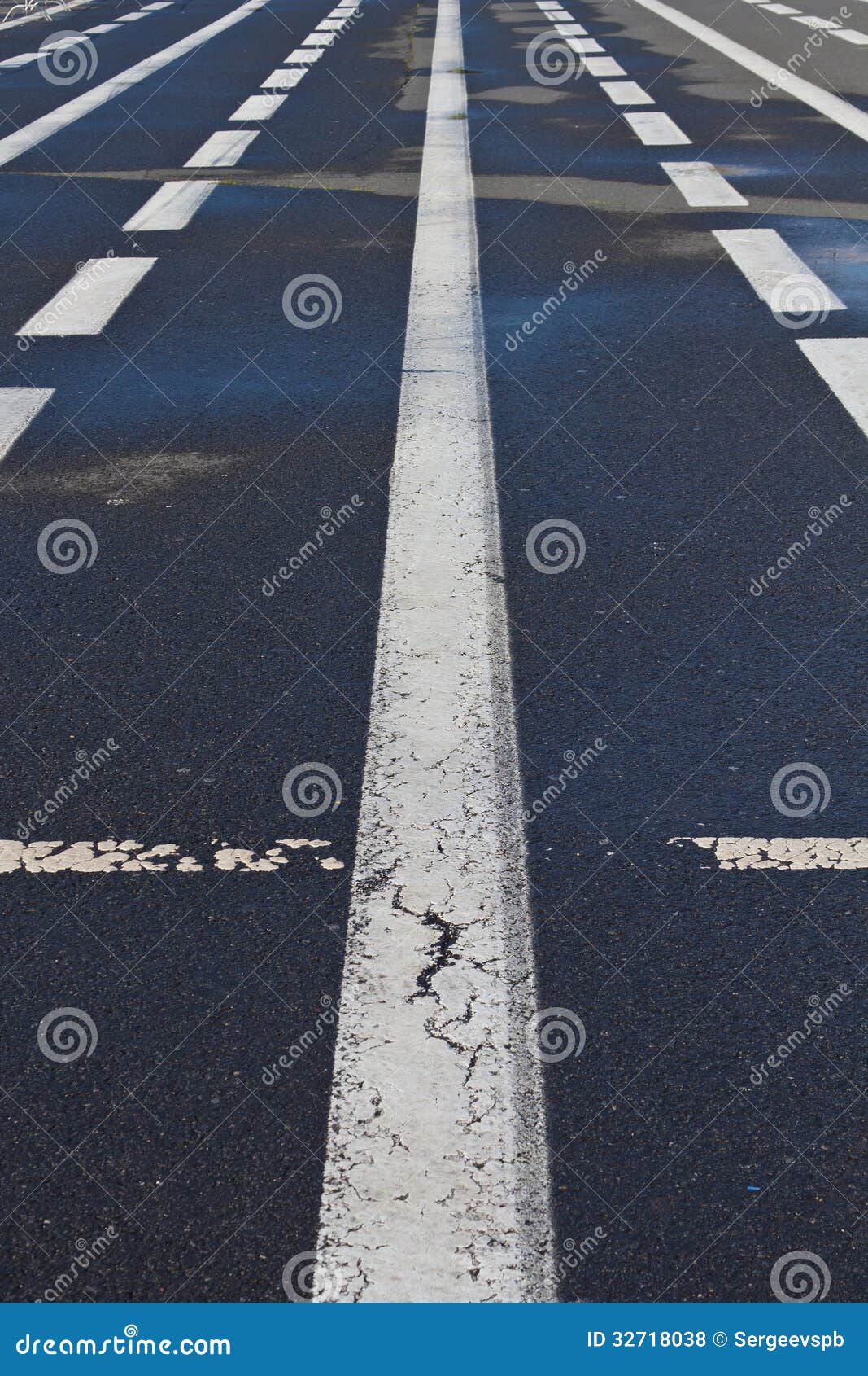 White Markings on the Pavement Stock Photo - Image of black, pavement ...