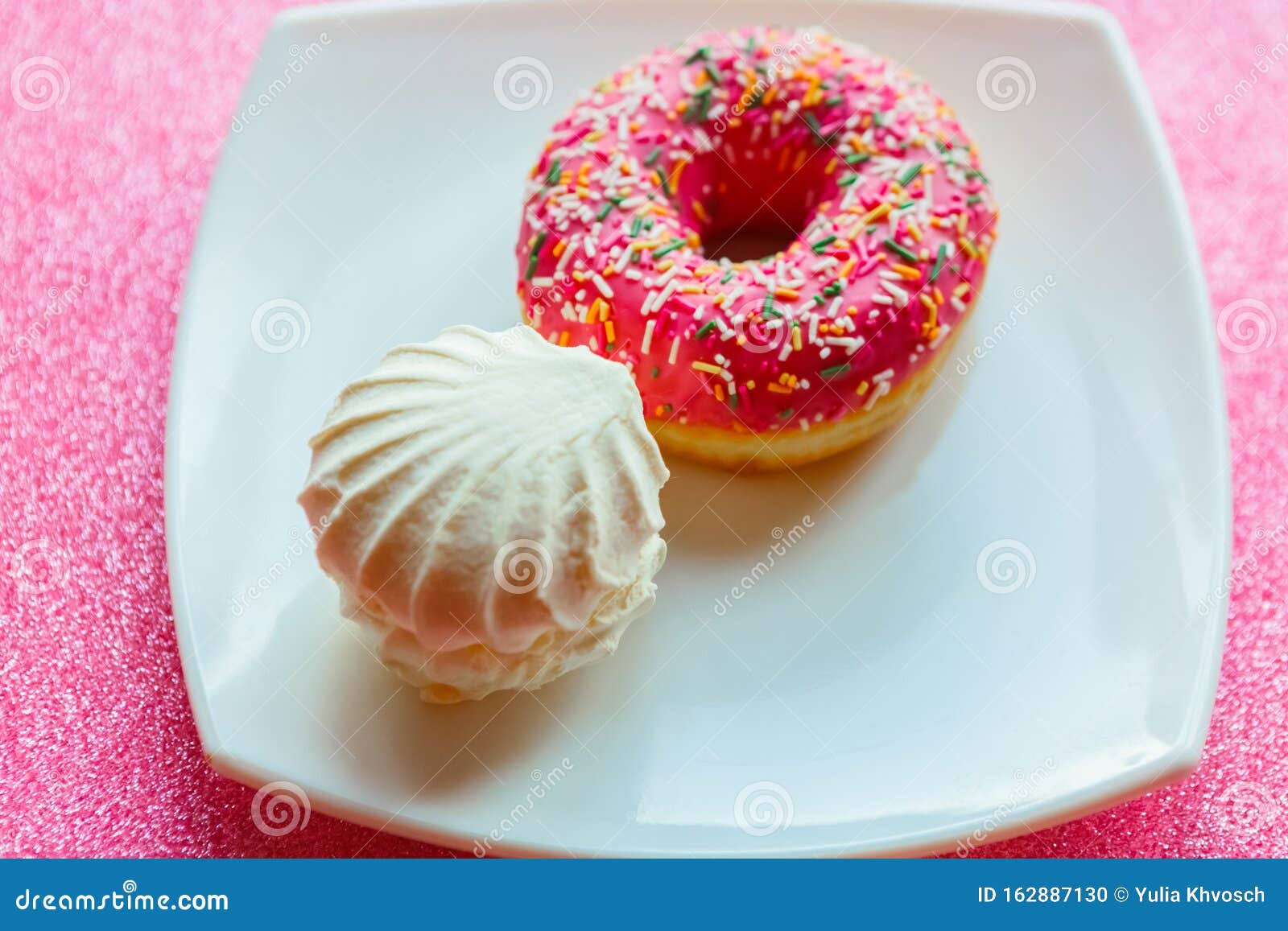 White Marshmallow and Pink Donut on White Plate Stock Photo - Image of ...