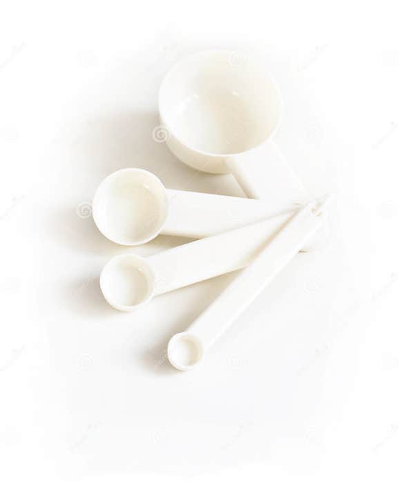 White Measuring Spoons on a White Background Stock Photo - Image of ...