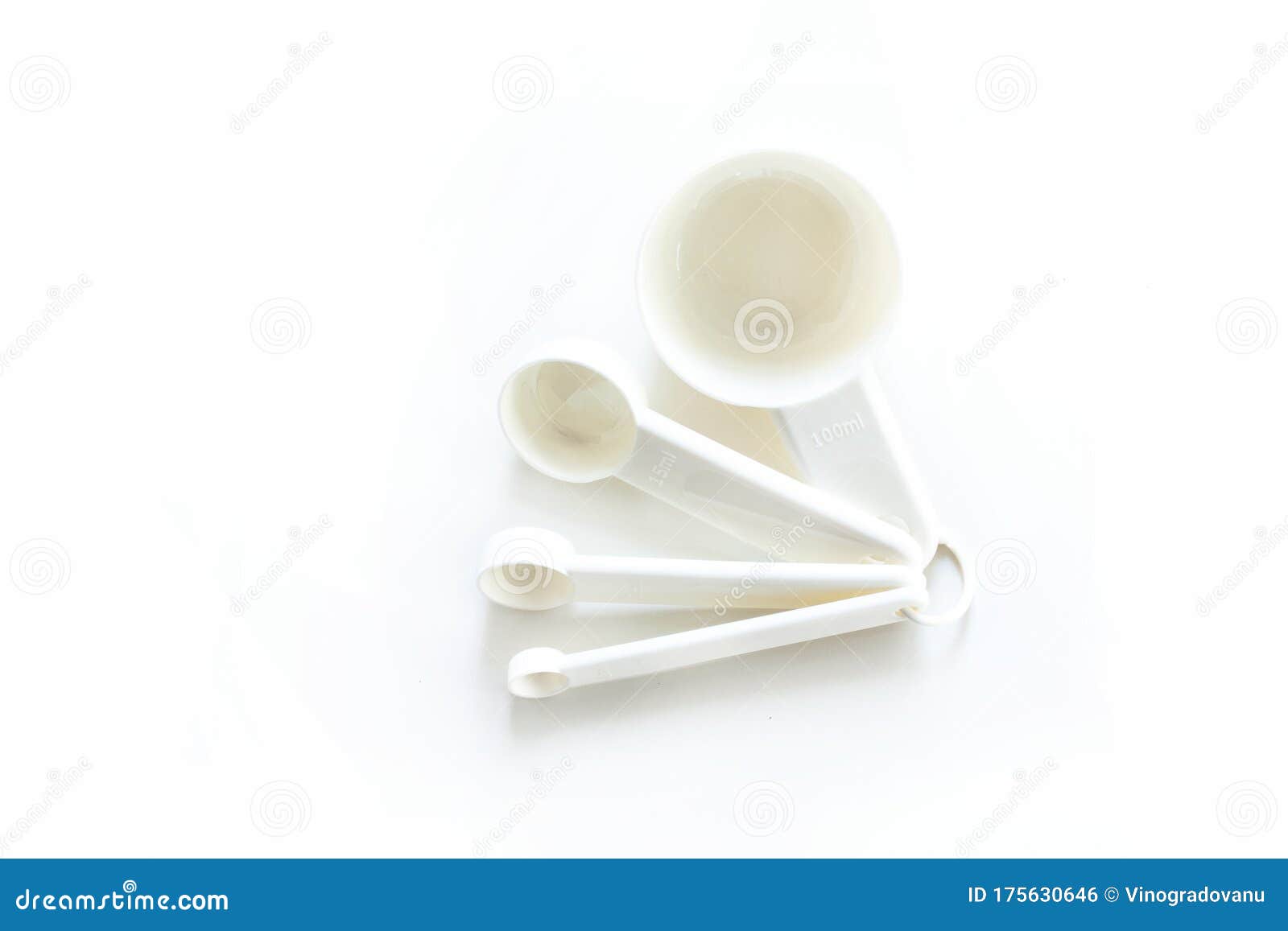 White Measuring Spoons on a White Background Stock Photo - Image of ...