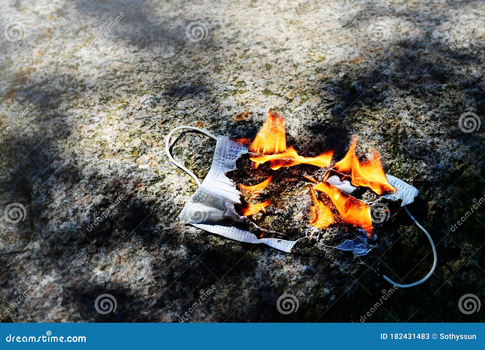 White Medical Mask is Burning on the Ground. Stock Image - Image of ...