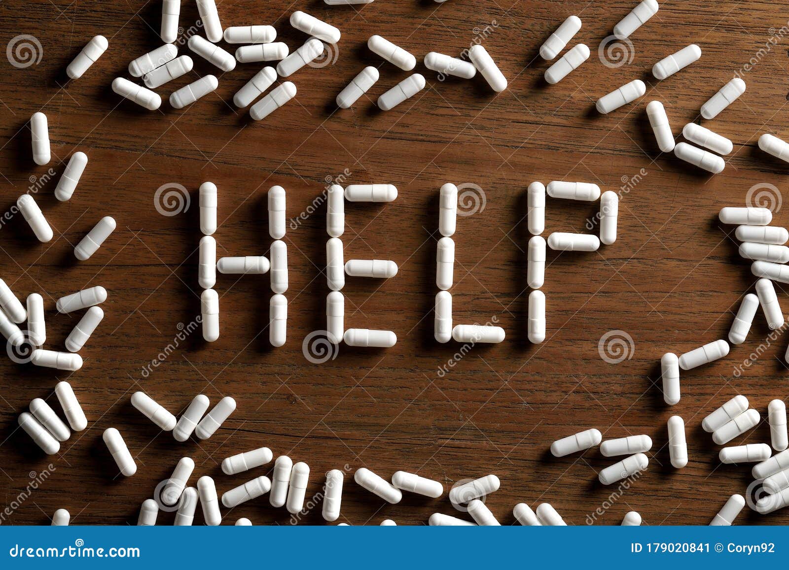 White Medical Tablets on Wooden Table Forming an Inscription Help Stock ...