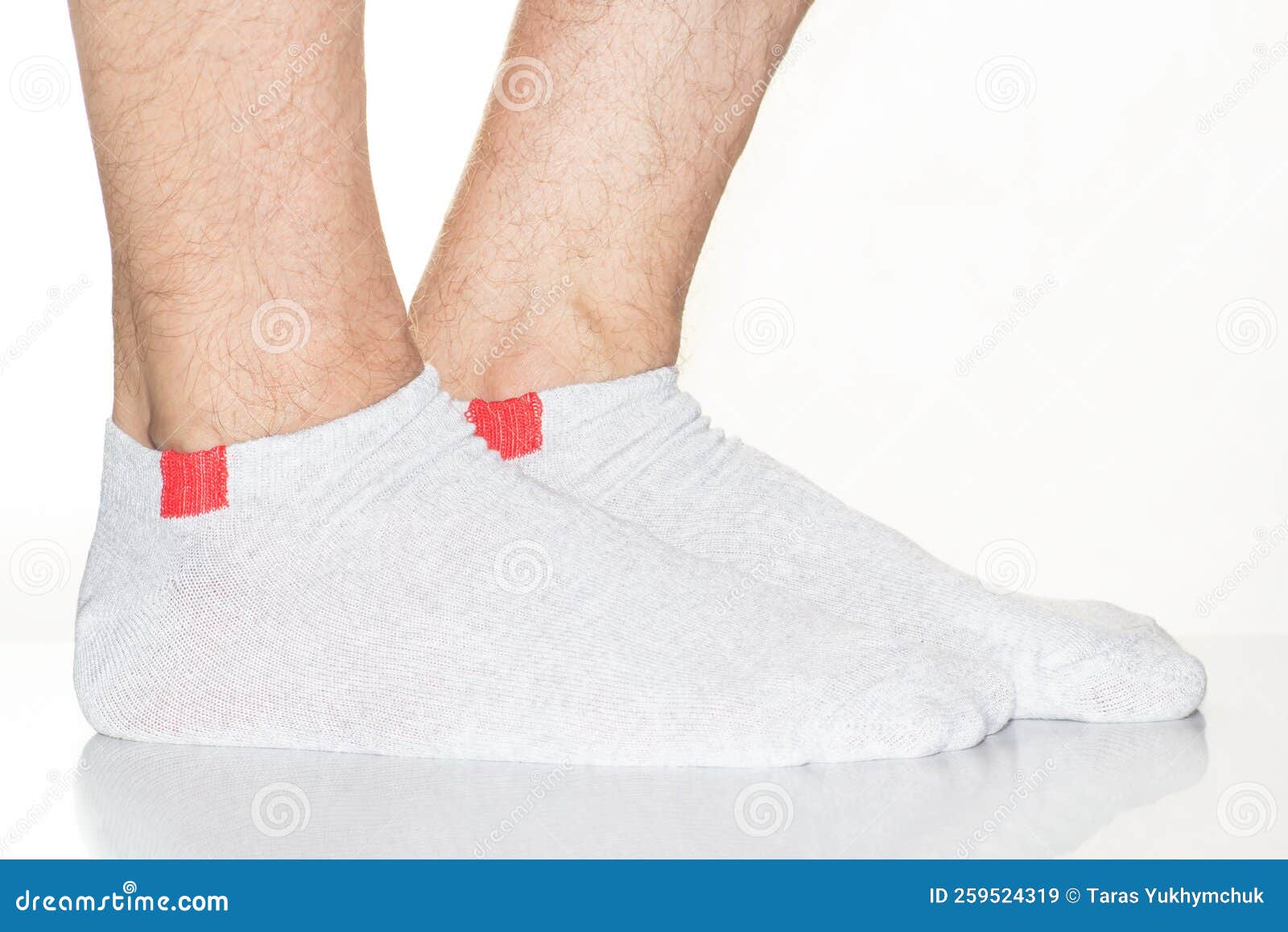 White Men S Socks with a Red Insert on the Feet, Legs in Socks on a ...