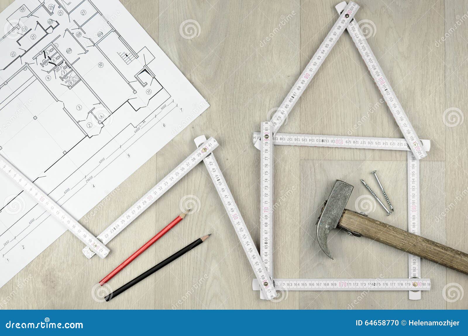 White Meter Tool Forming a House and Engineering Tools on Woode Stock ...