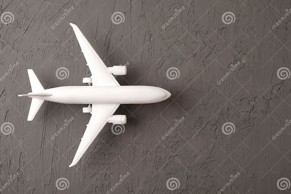White Model Airplane on Black Textured Background Stock Photo - Image ...