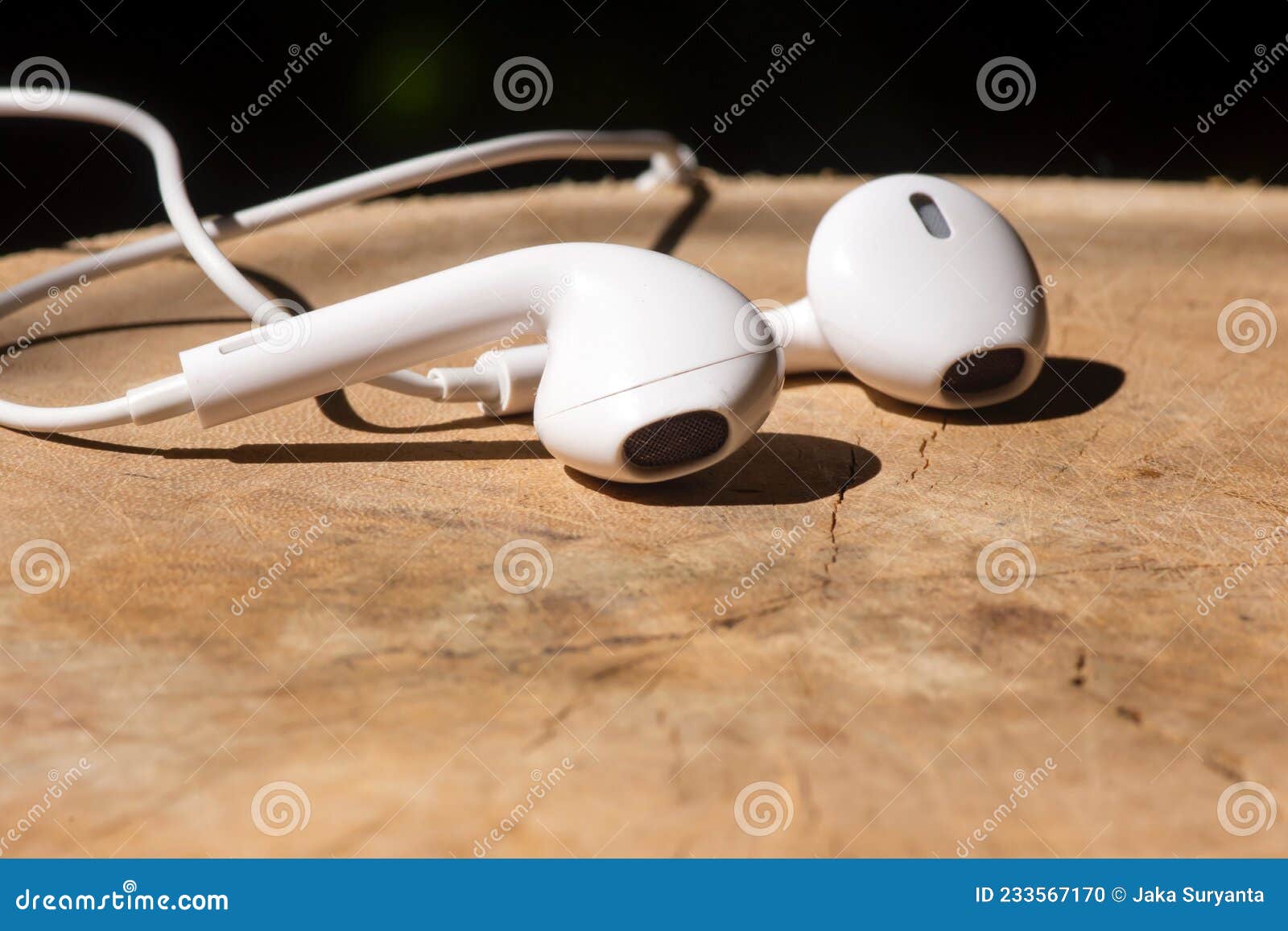 White Modern Earphones, Headset, on Wood Table Stock Photo - Image of ...