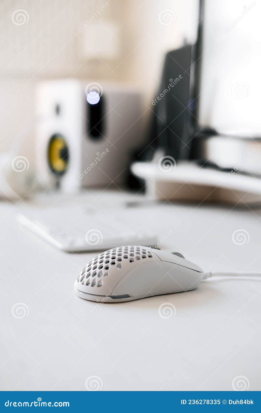 White Modern Wired Gaming Mouse in a White Comfortable Gamer Workspace ...