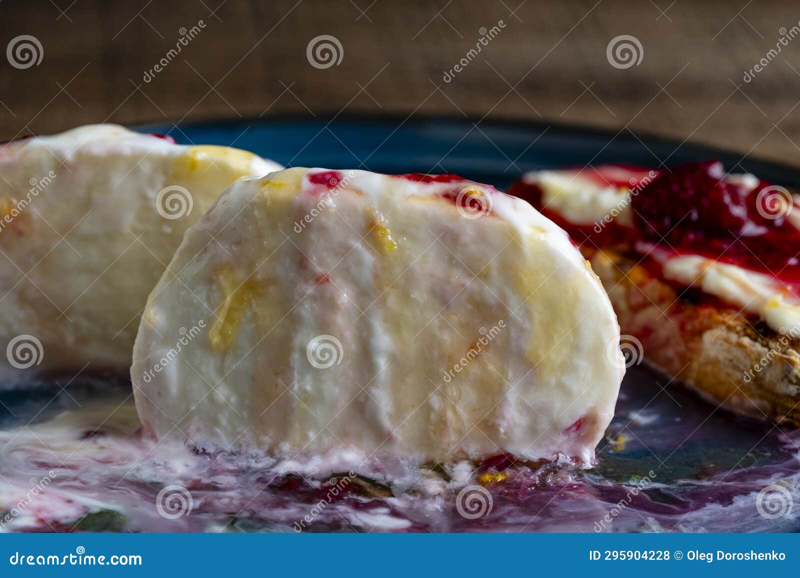 White Mozzarella Cheese Served with Raspberry Jam and Honey on a Plate ...